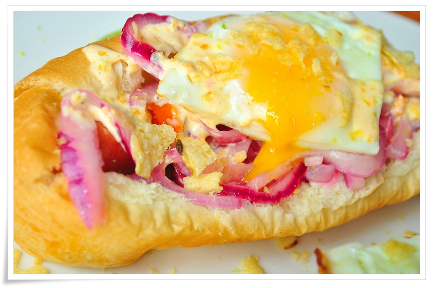 Hot Dog a la Peruana with Fried Egg, Pickled Onions, and Salsa Golf ...